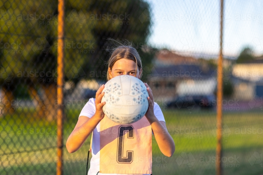 Image of 12 year old girl with flyaway hair wearing centre bib holding ...