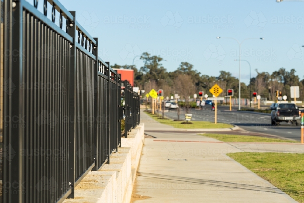 Image of Concrete footpath in suburban streetscape - Austockphoto