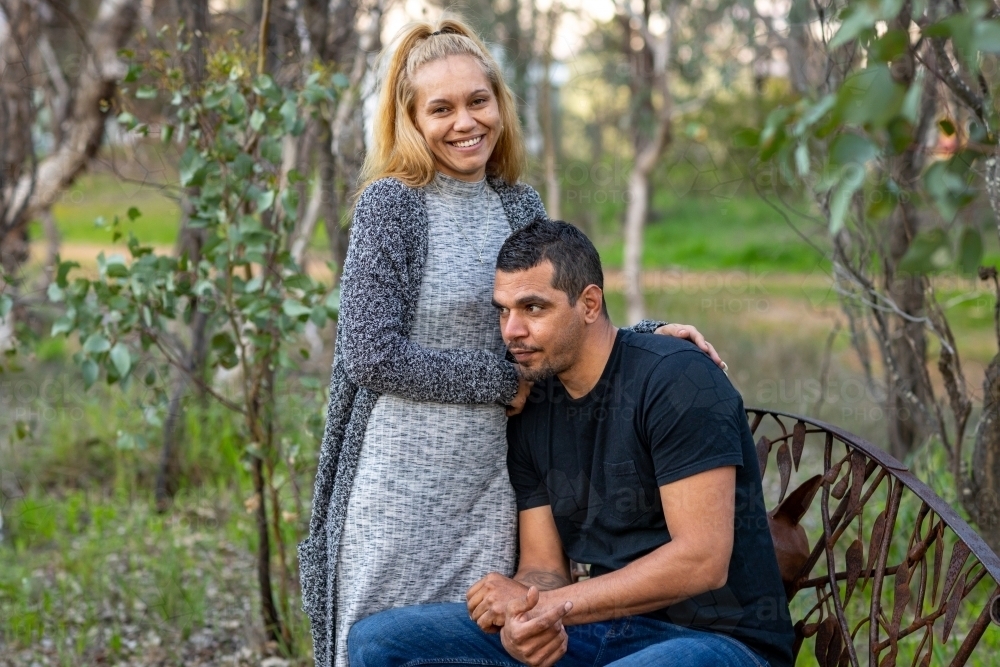 Image of 20 couple in their 20s together in bushland setting - Austockphoto