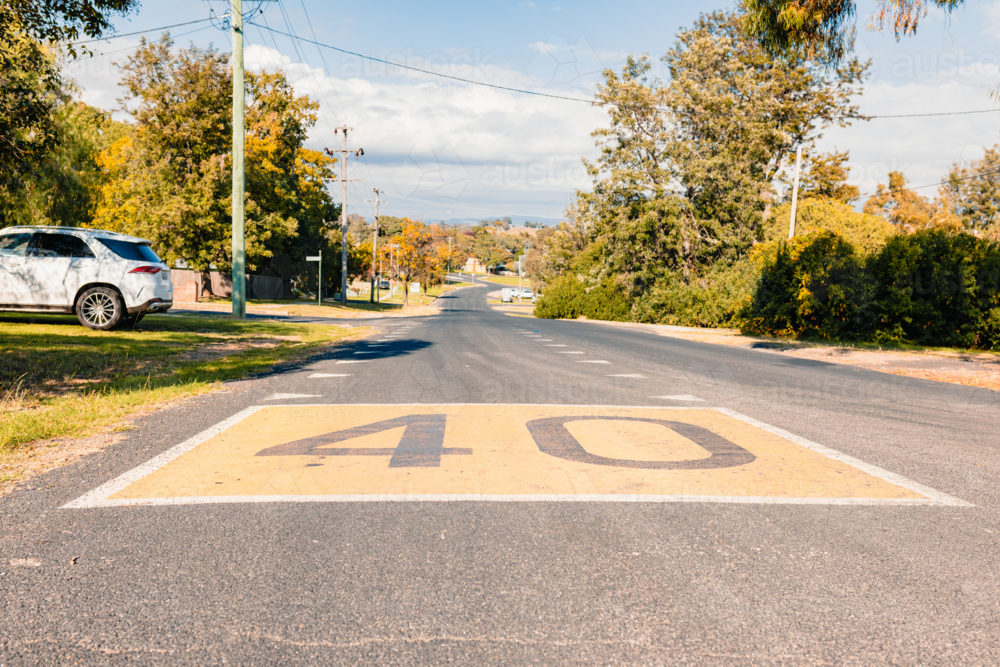 Image of 40 kmh speed limit painted on road in small town's school zone ...