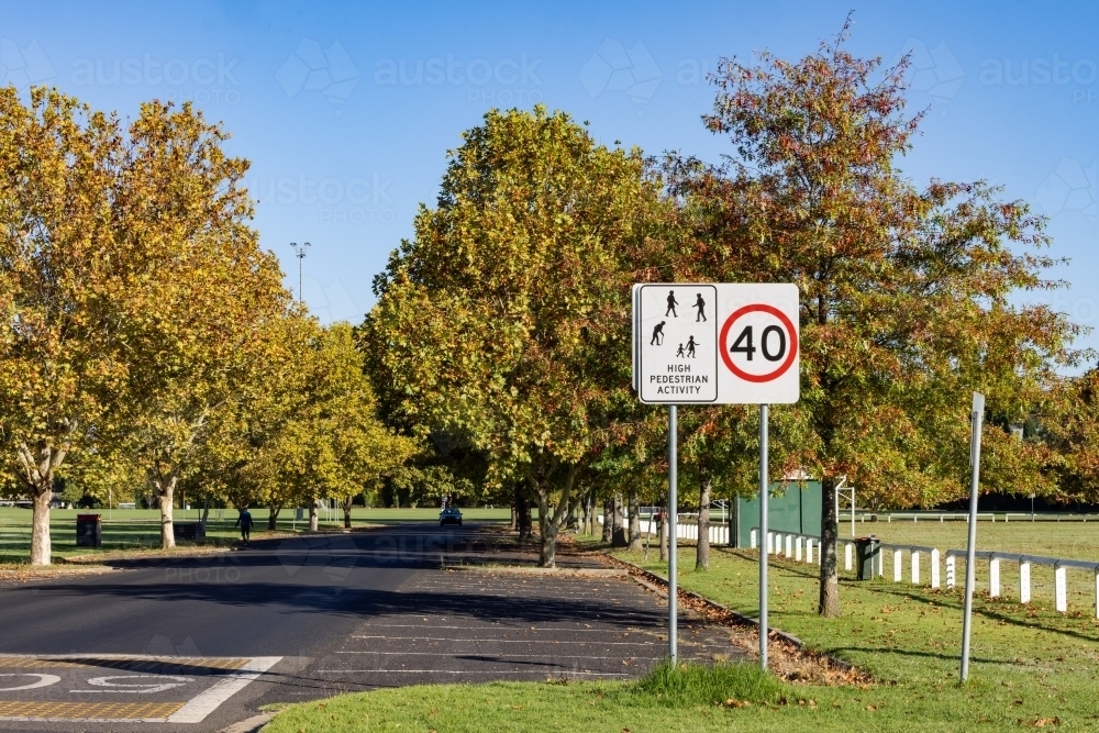 Image of 40 speed limit sign in high pedestrian sports field car park ...