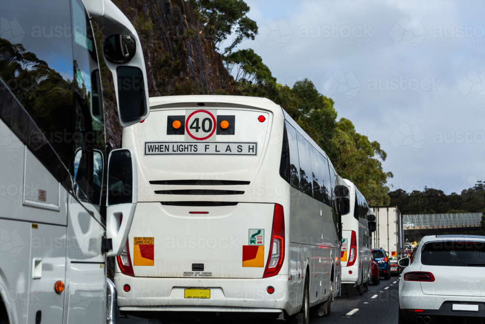 Image of 40 when lights flash sign on back of busses traveling in heavy ...