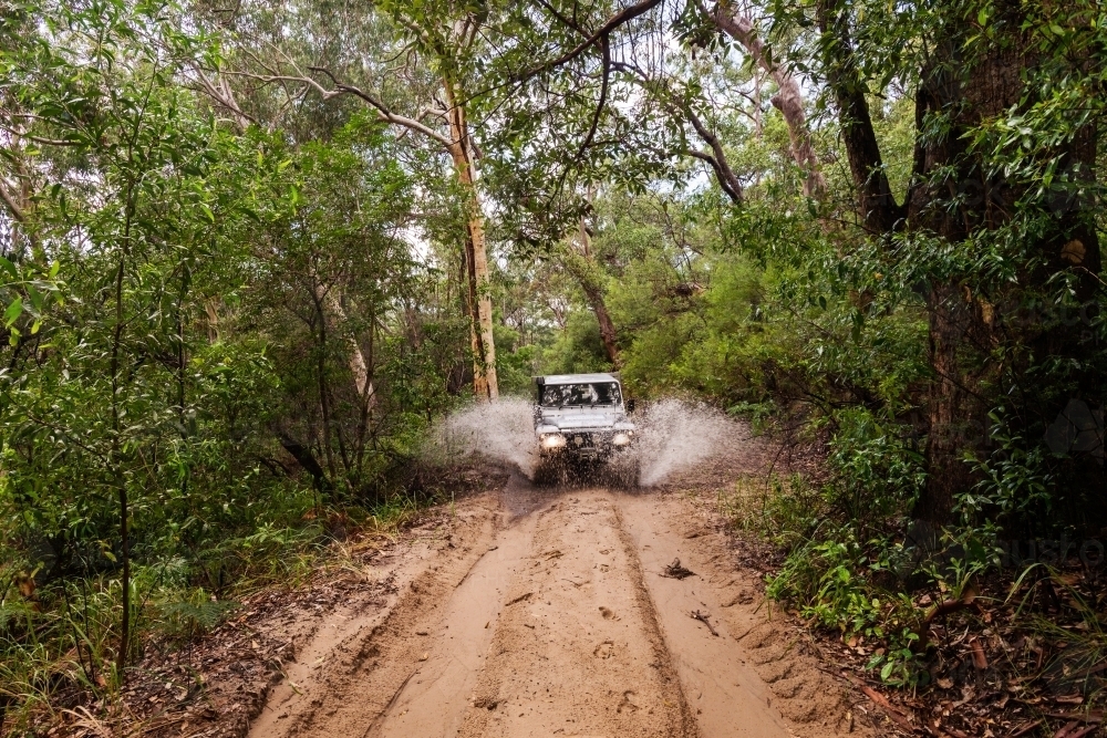 Image of 4x4 making a splash - Austockphoto
