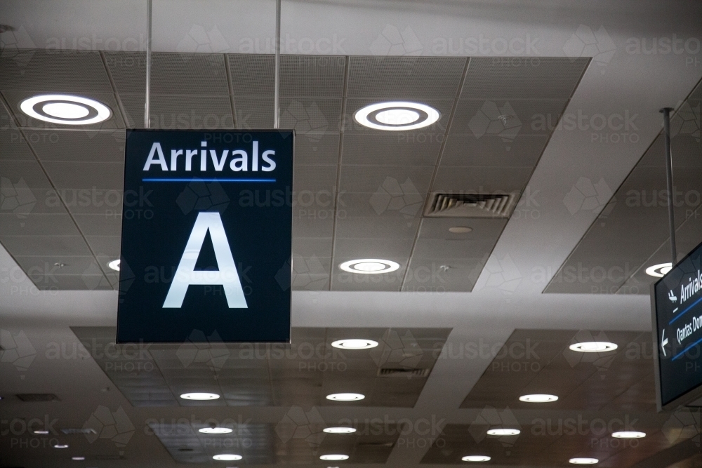 Image of A and Arrivals sign at large international airport - Austockphoto