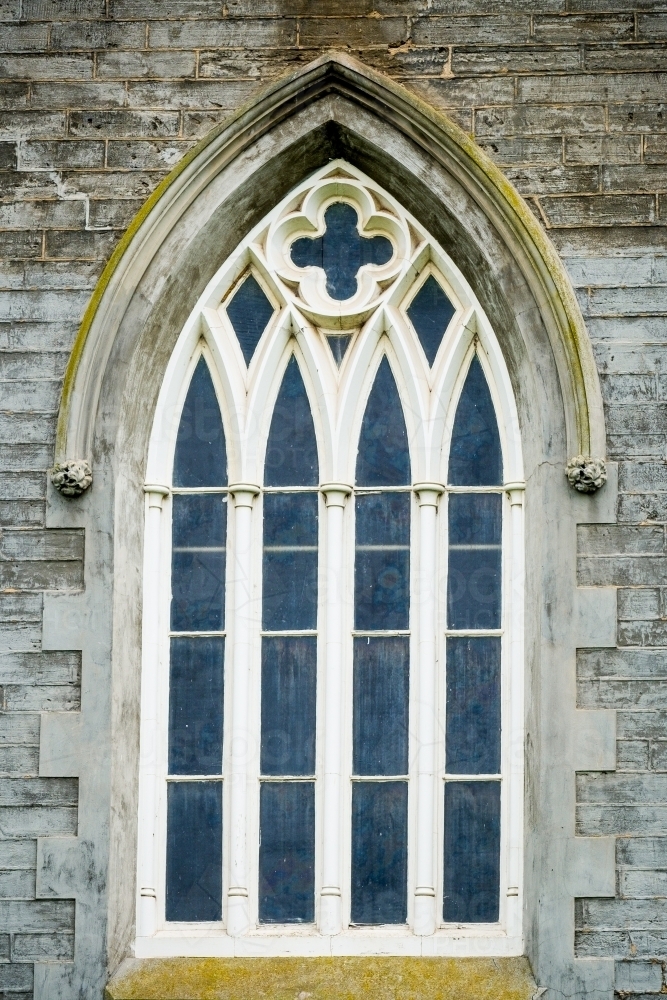 Image of A beautiful old country church window - Austockphoto