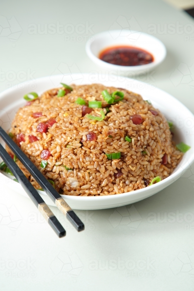 Image of A bowl of fried rice - Austockphoto