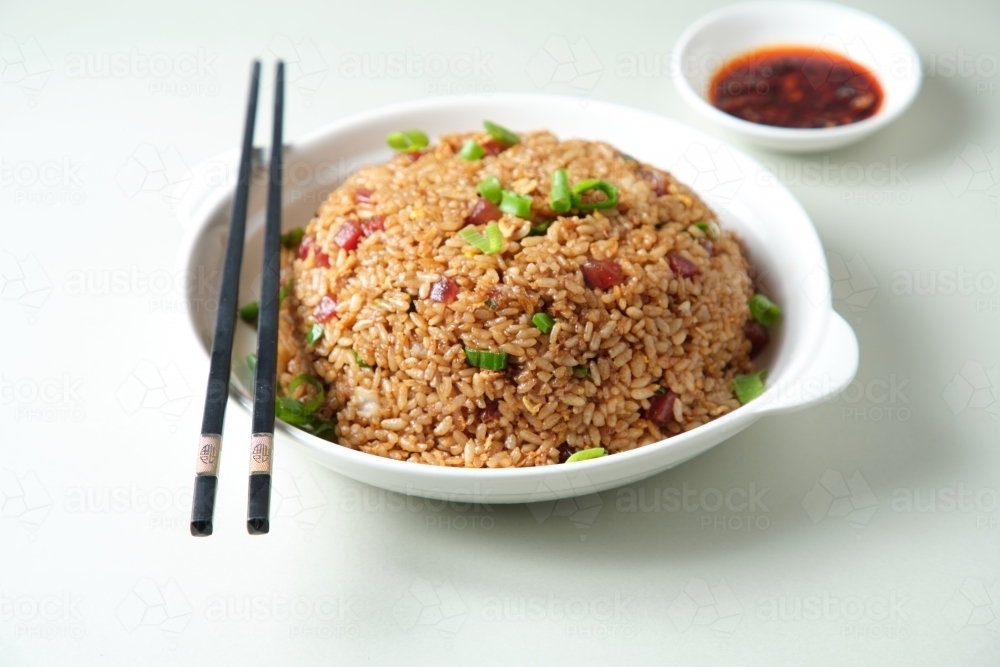 Image of A bowl of fried rice - Austockphoto