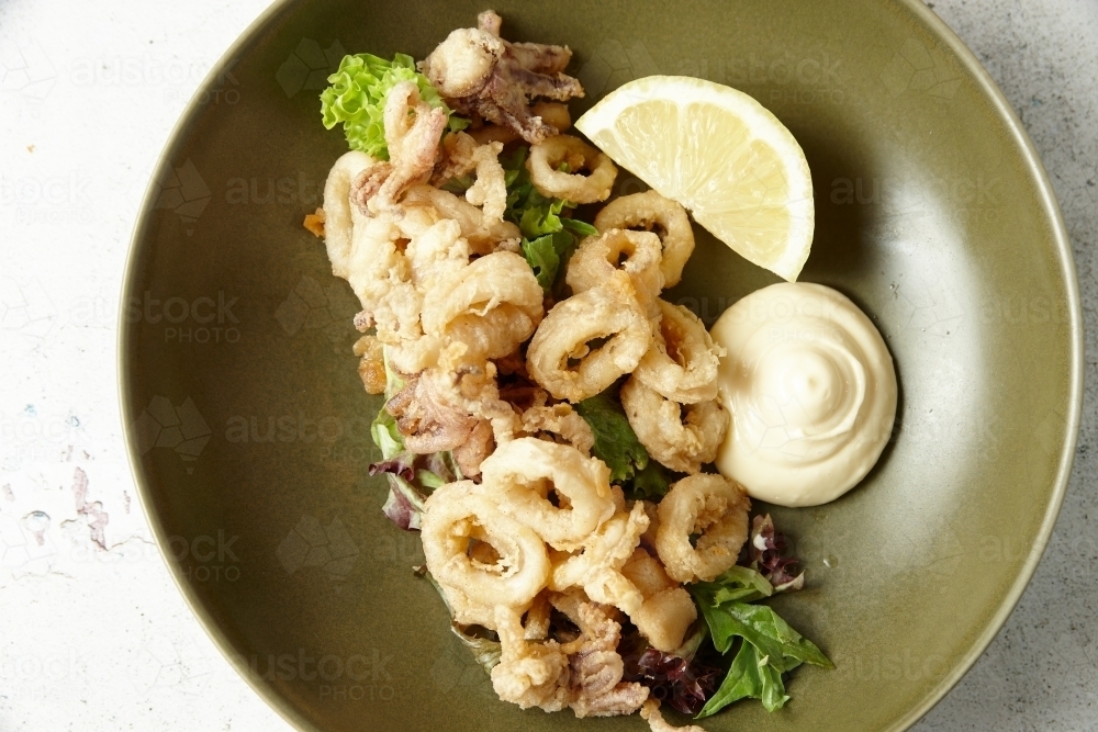Image of A bowl of squid rings - Austockphoto