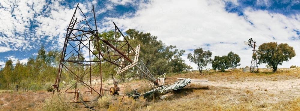 Image of A broken windmill lying on the ground - Austockphoto