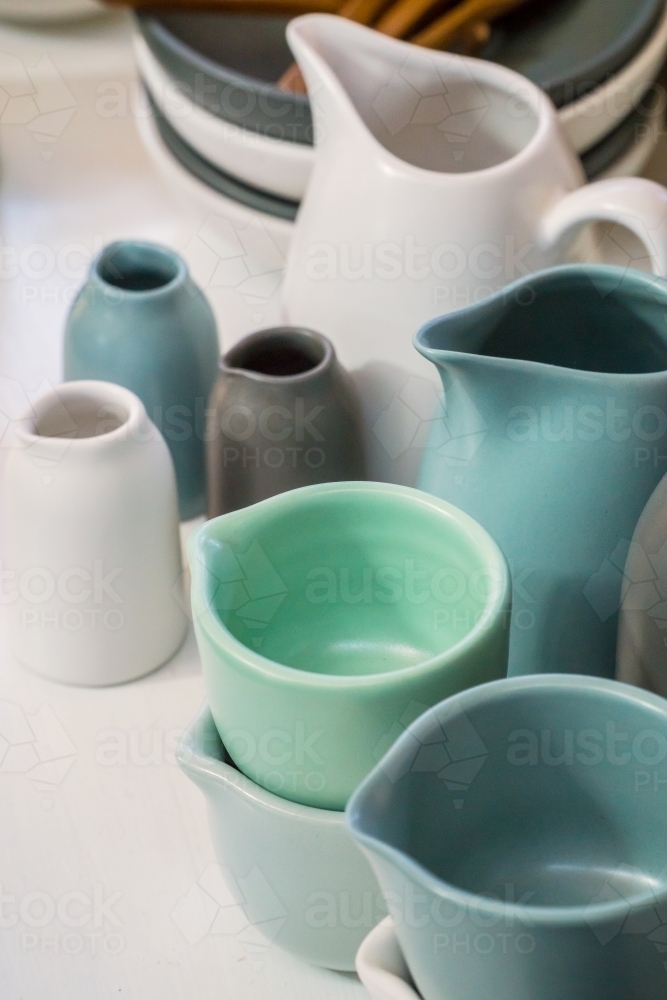 Image of A collection of small jugs - Austockphoto