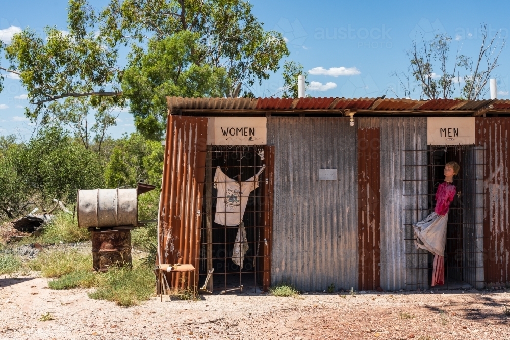 Image of A corrugated iron toilet block in an outback town with signs ...