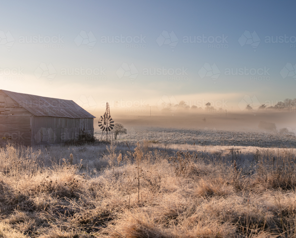 Image of A country scene on a misty morning with a broken windmill and ...