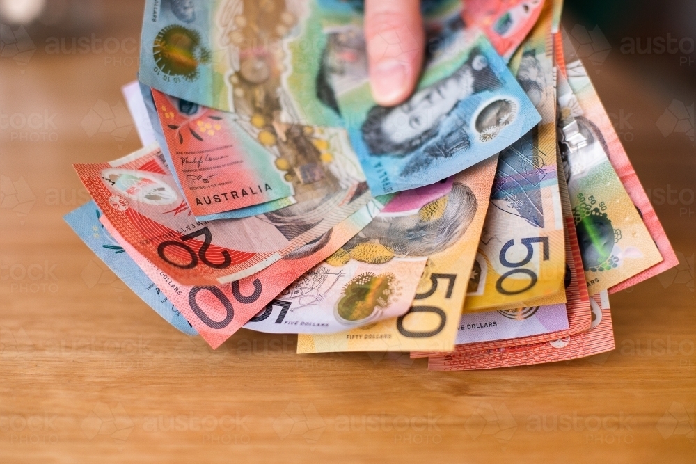 Image of a fan of Australian money notes - Austockphoto