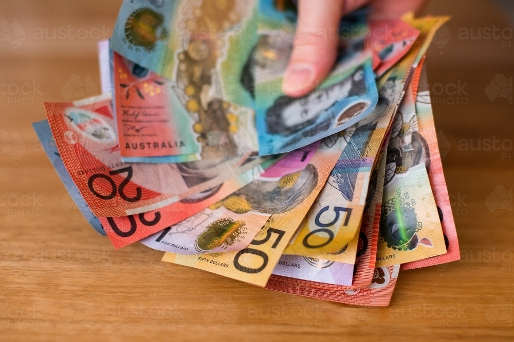 Image of a fan of different Australian notes - Austockphoto