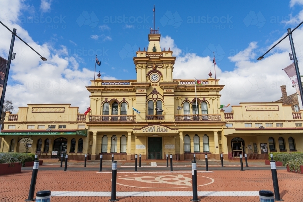 Image of A grand historic Town Hall with a clock tower behind rows of ...