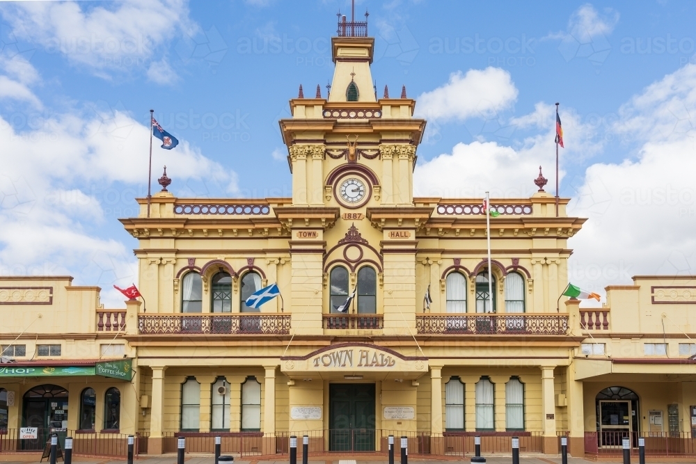 Image of A grand historic Town hall with arched windows and wide clock ...
