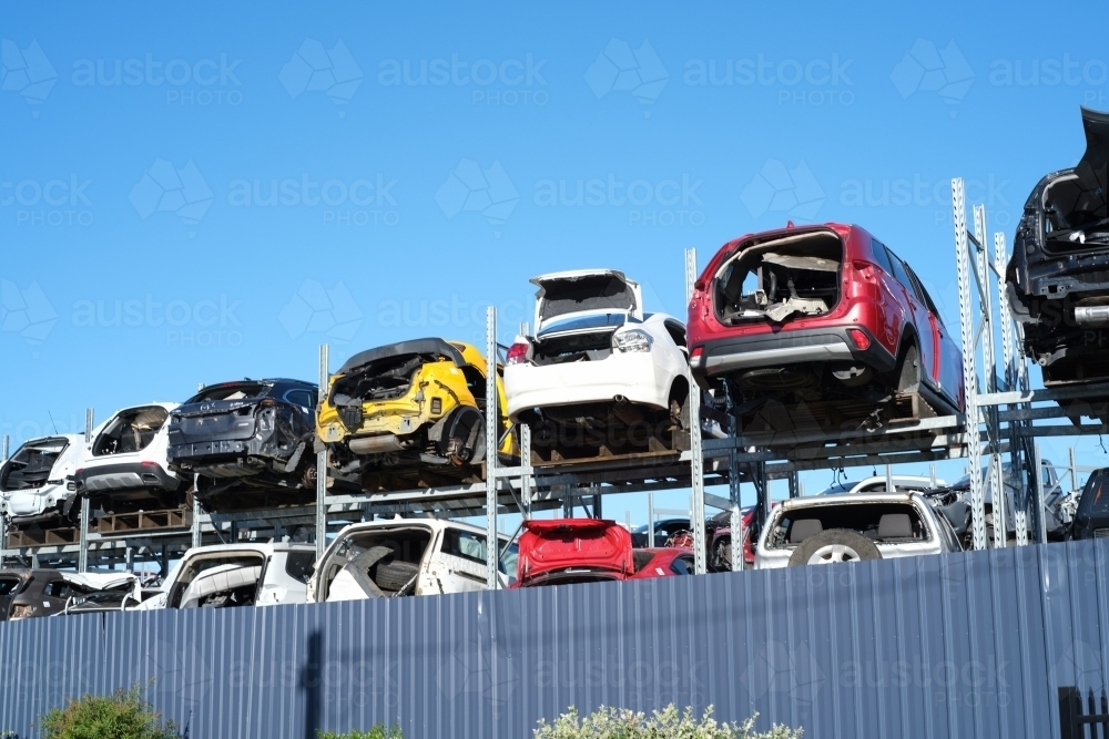 Image of A multi-level car storage structure filled with various ...