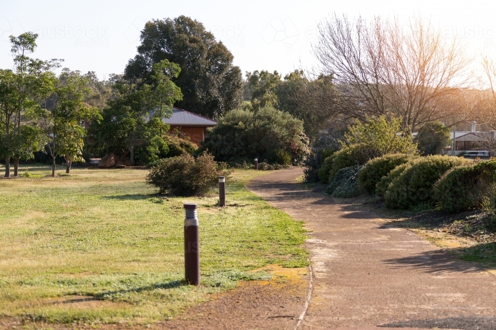 Image of A path through a park - Austockphoto