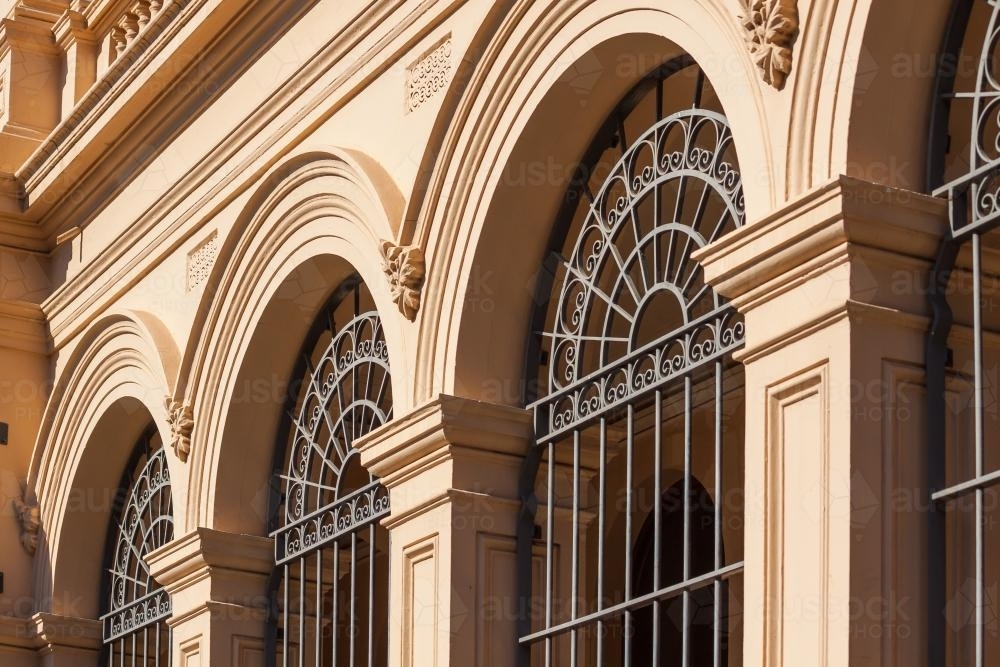 Image of A row of arches on an old building - Austockphoto