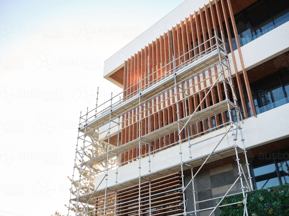Image of a scaffolding around the building under construction ...