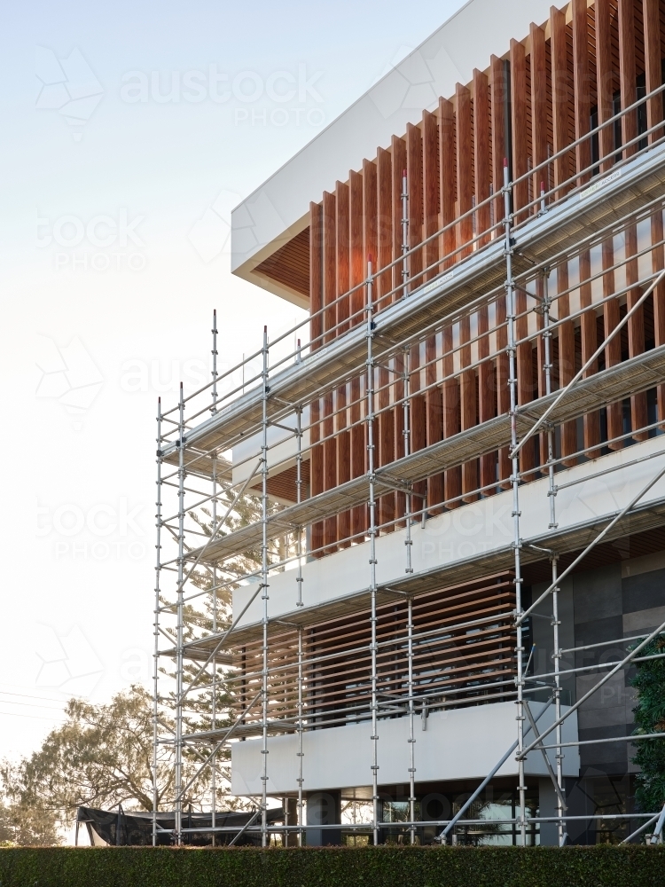 Image of a scaffolding around the building under construction ...