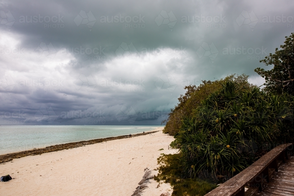 Image of a tropical storm approaching an island on the great barrier ...