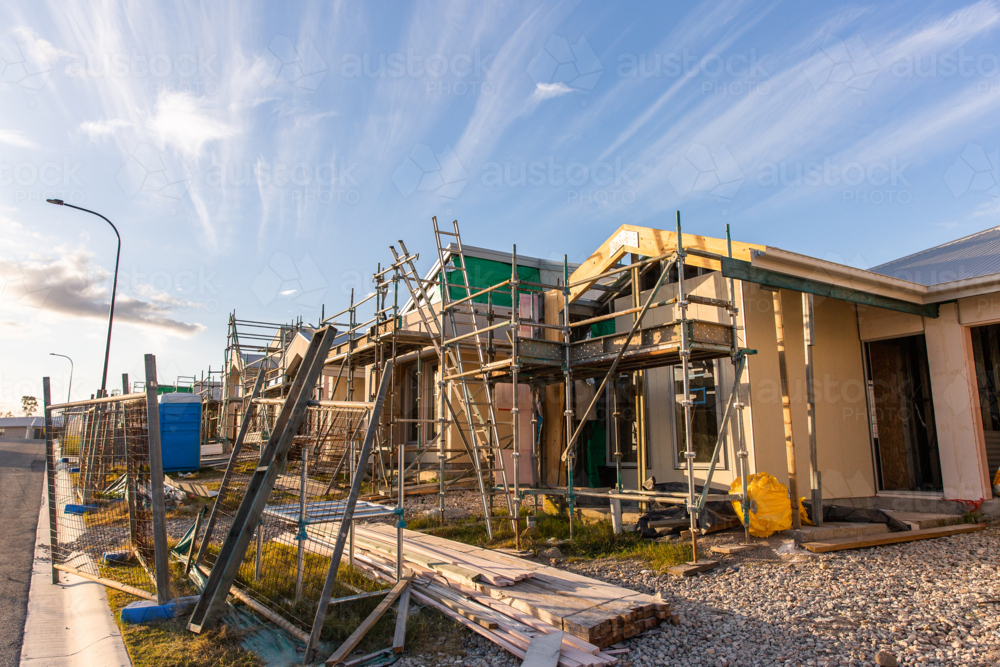 Image of a whole street of houses getting built at a new housing estate ...