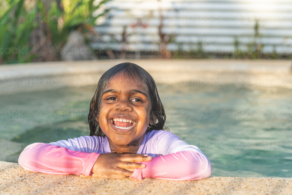 Image of Aboriginal 3 year old girl in the pool - Austockphoto
