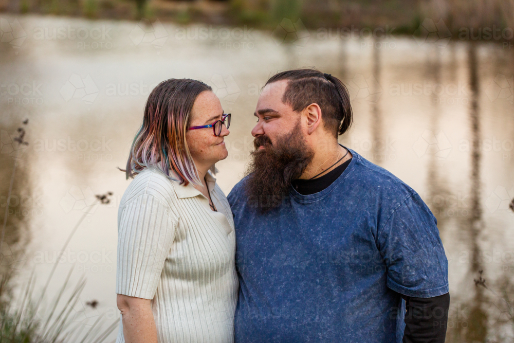Image of Aboriginal australian couple standing together by waterside at ...