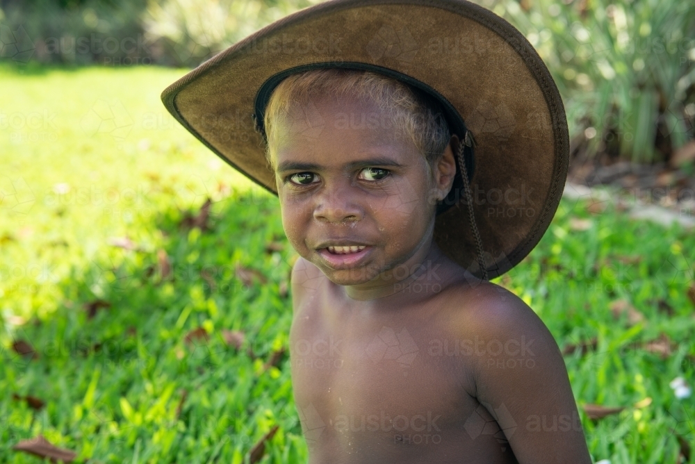 Image of Aboriginal boy wearing hat - Austockphoto