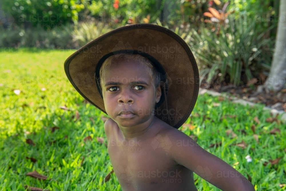 Image of Aboriginal boy wearing hat - Austockphoto