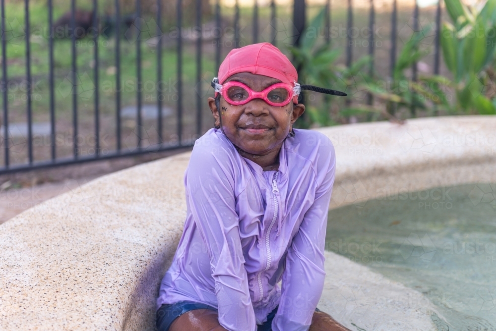 Image of Aboriginal child in the pool - Austockphoto