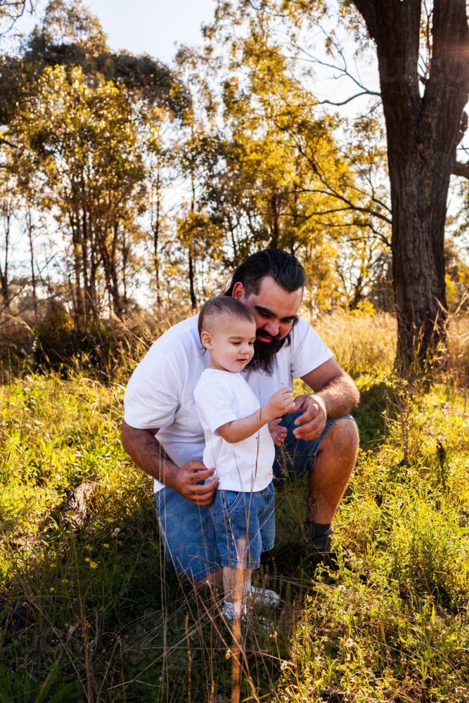 Image of Aboriginal father and son looking at nature together in rural ...
