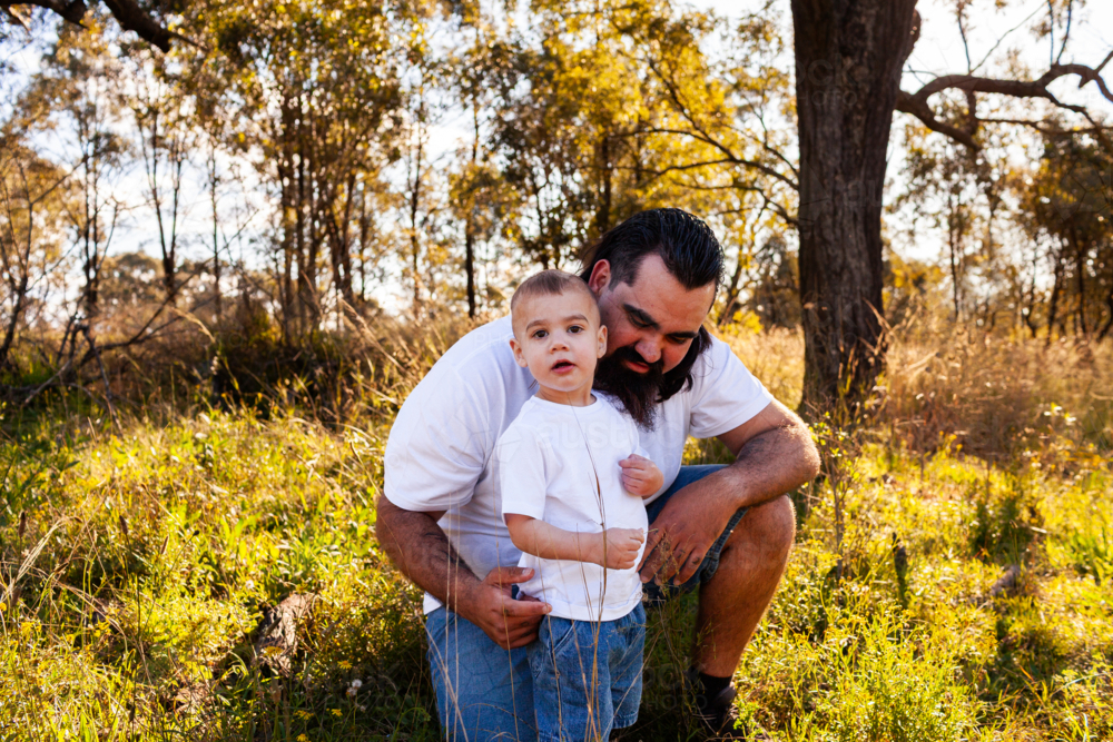 Image of Aboriginal father and son looking at nature together in rural ...