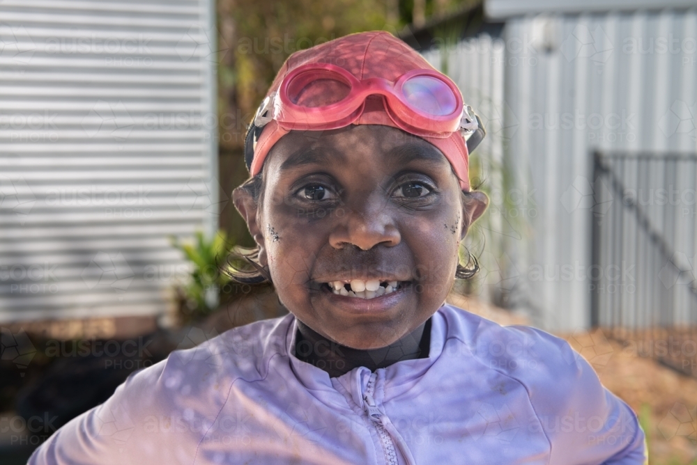 Image of Aboriginal girl about to go swimming - Austockphoto