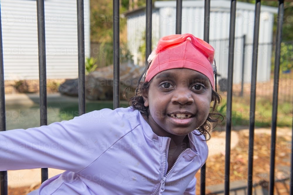 Image of Aboriginal girl about to go swimming - Austockphoto