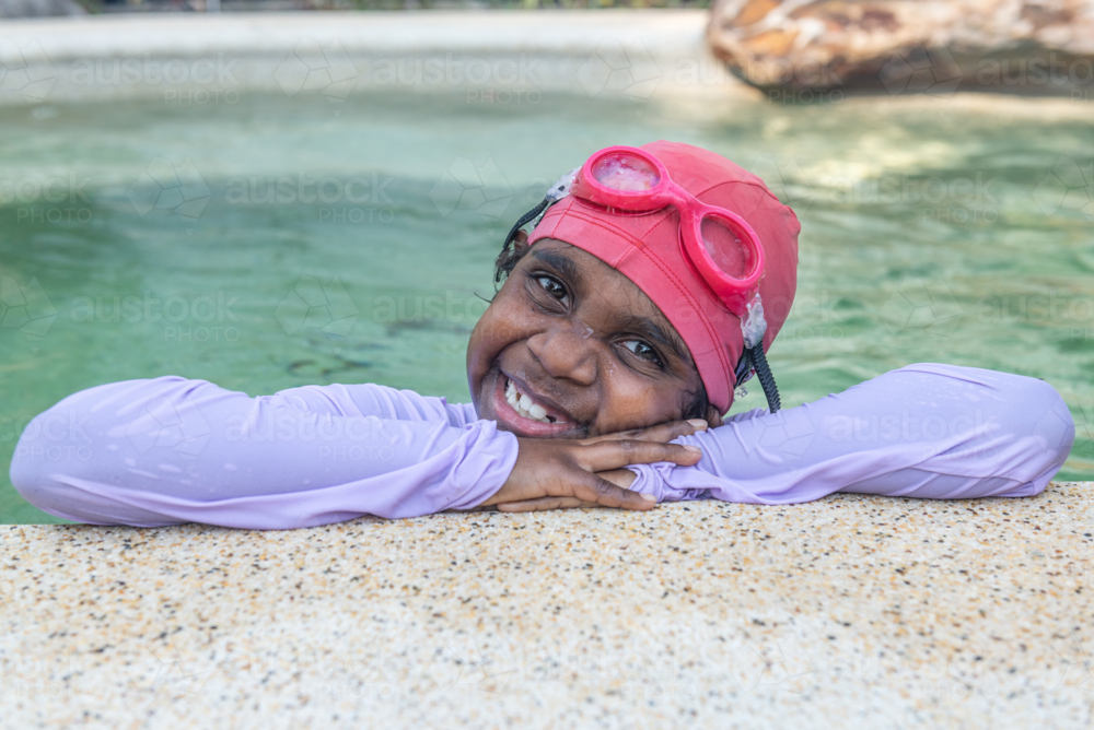 Image of Aboriginal girl in pool - Austockphoto