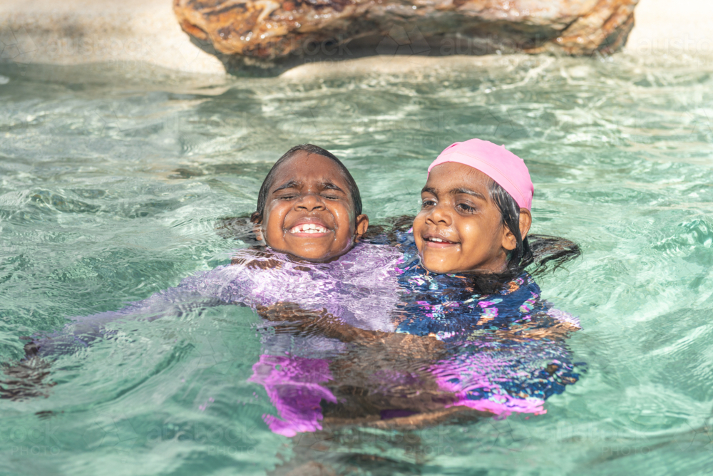 Image of Aboriginal girls in the pool - Austockphoto