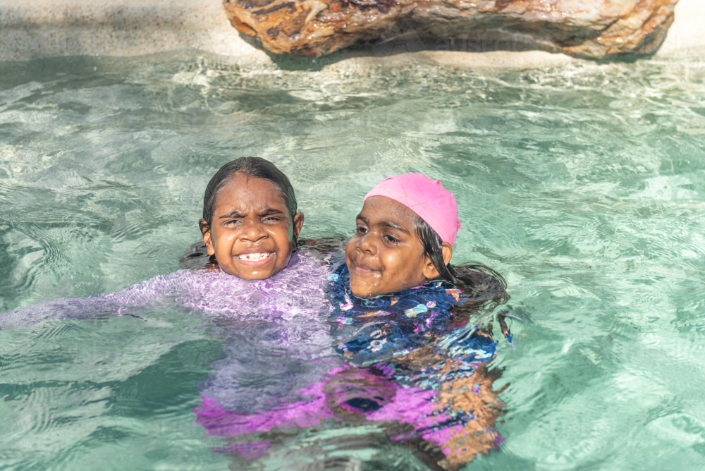 Image of Aboriginal girls in the pool - Austockphoto