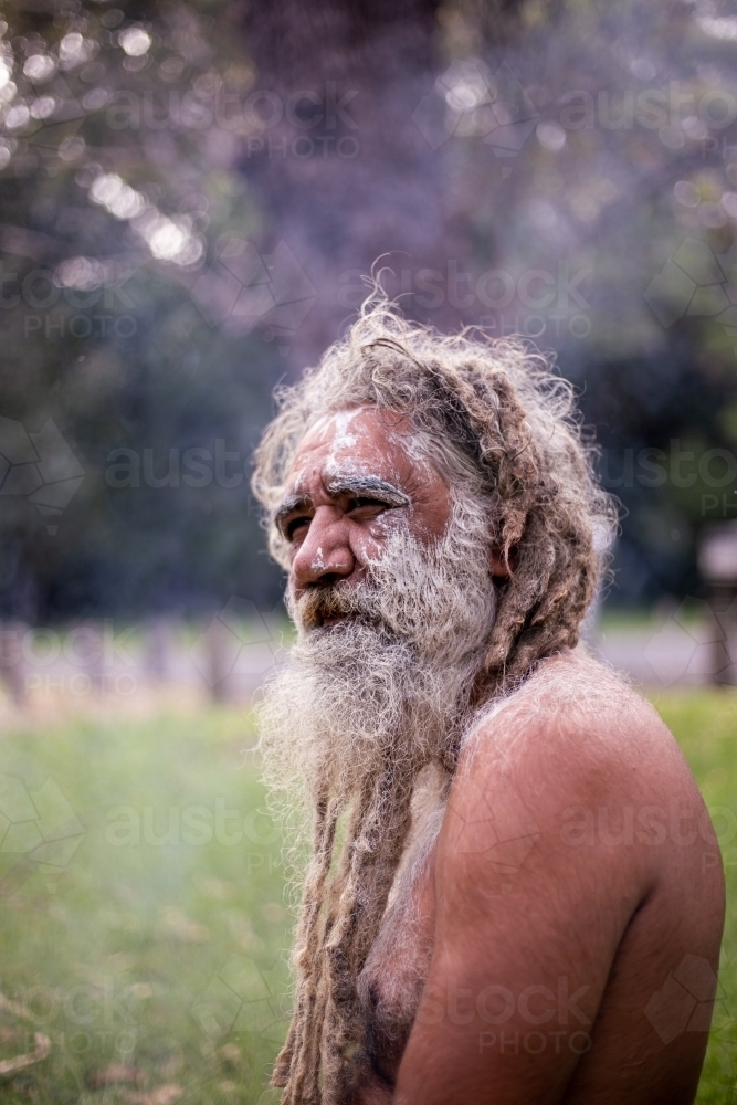 Image of Aboriginal man looking into the distance - Austockphoto
