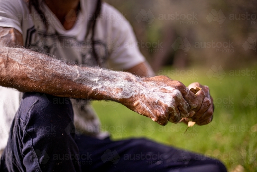 Image of Aboriginal man making a smoke ceremony - Austockphoto