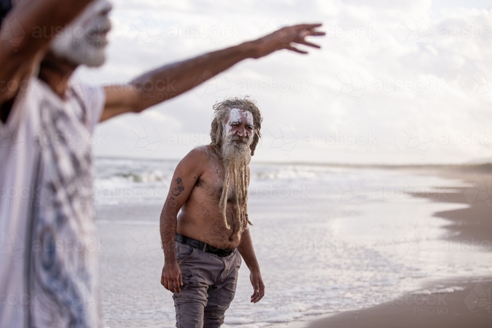 Image of Aboriginal middle aged man listening to another Aboriginal man ...