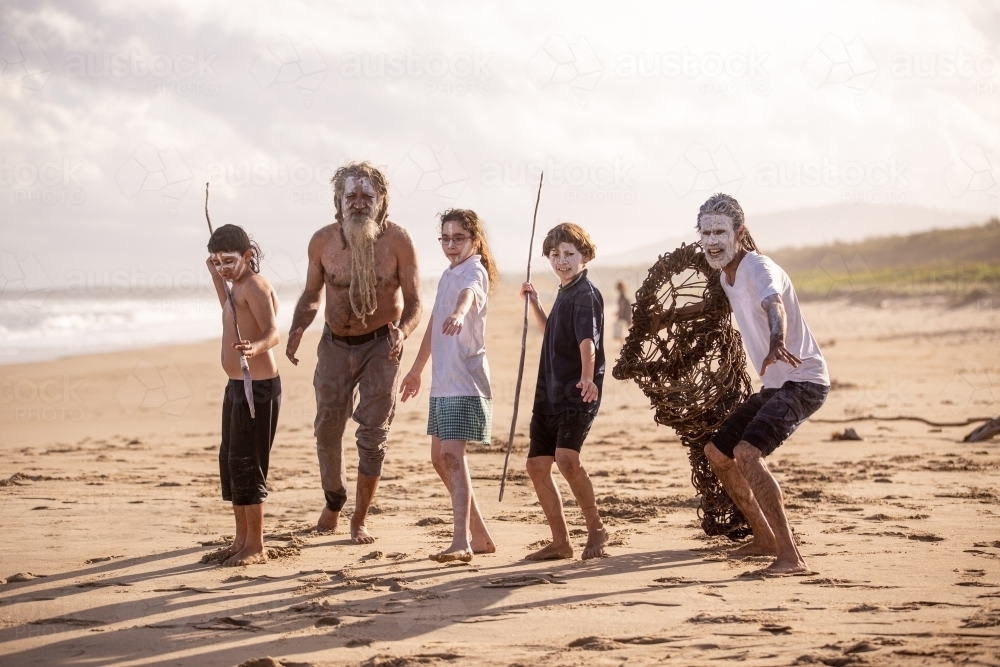Image of Aboriginal mob at the beach looking at camera elders with next ...