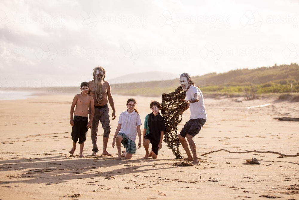 Image of Aboriginal mob at the beach looking at camera focus on ...