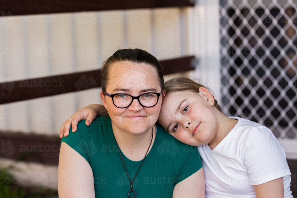 Image of Aboriginal mother and daughter together on front porch of ...