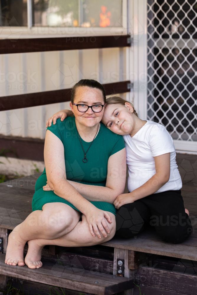 Image of Aboriginal mother and daughter together on front stairs of ...