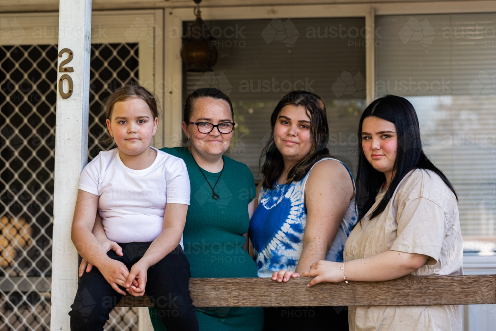 Image of Aboriginal mother in her thirties with teen daughters and ...