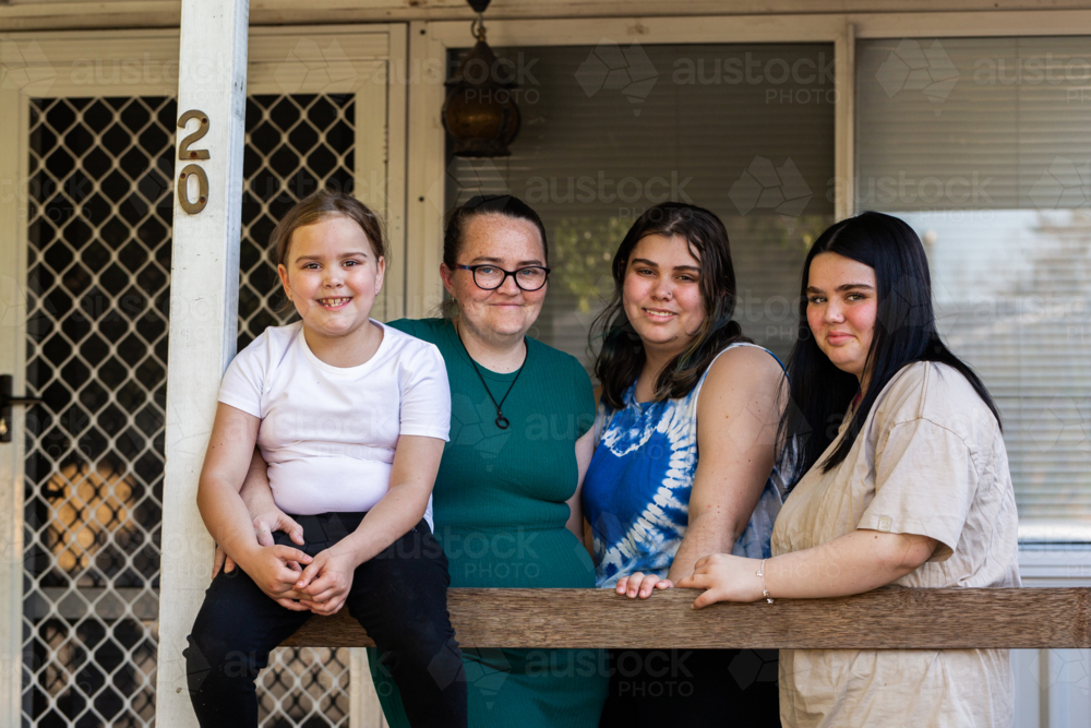 Image of Aboriginal mother in her thirties with teen daughters and ...
