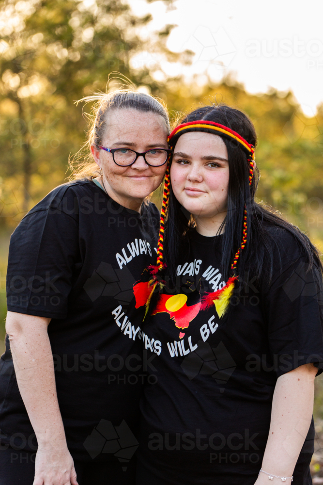 Image of Aboriginal mum and daughter together in golden light in ...