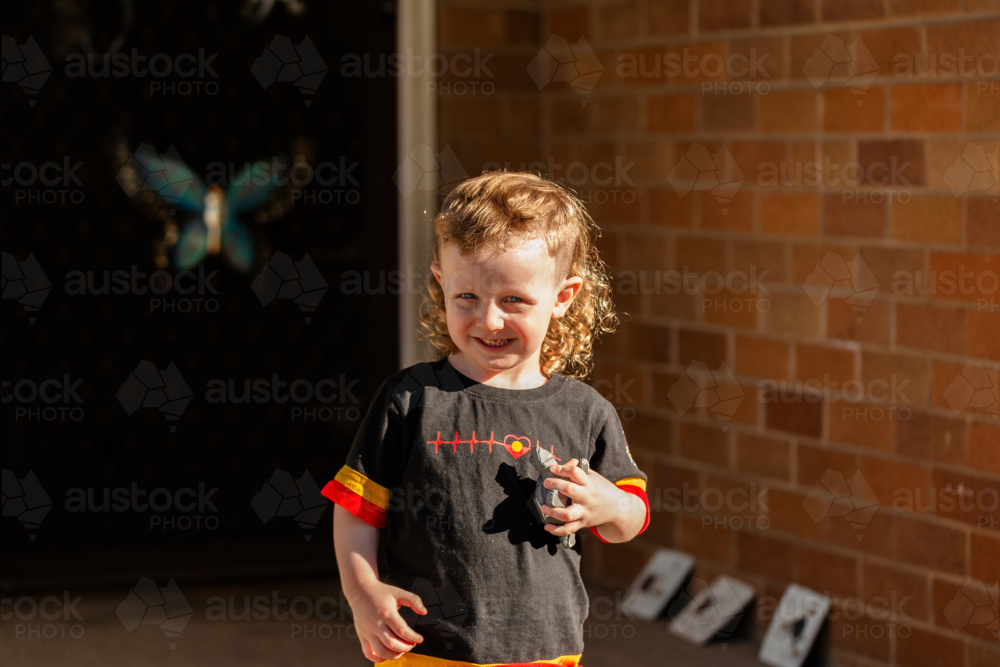 Image of Aboriginal toddler boy outside home smiling in sunshine ...